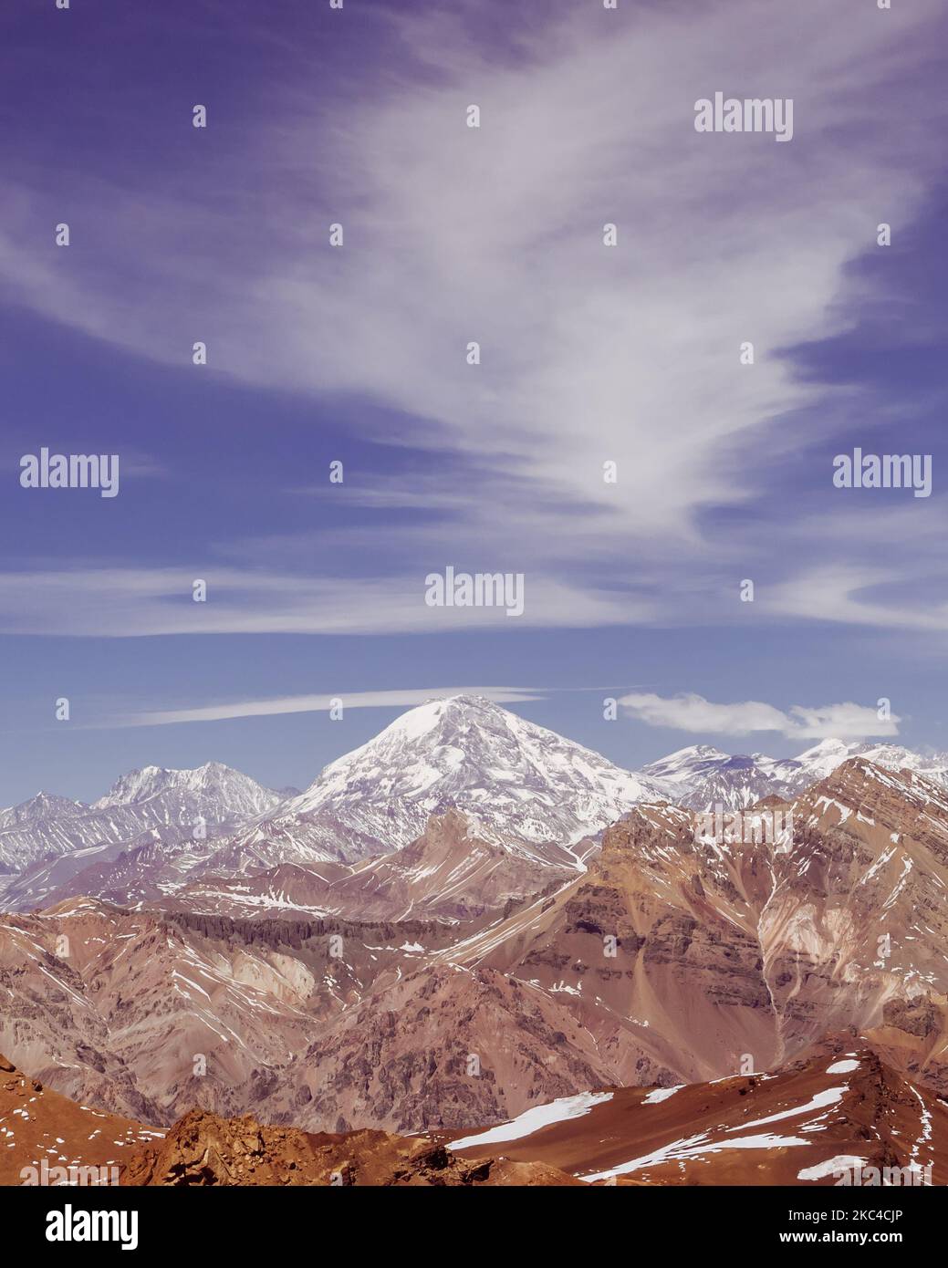 A vertical shot of the peaks of the Cordillera de los Andes in Mendoza ...