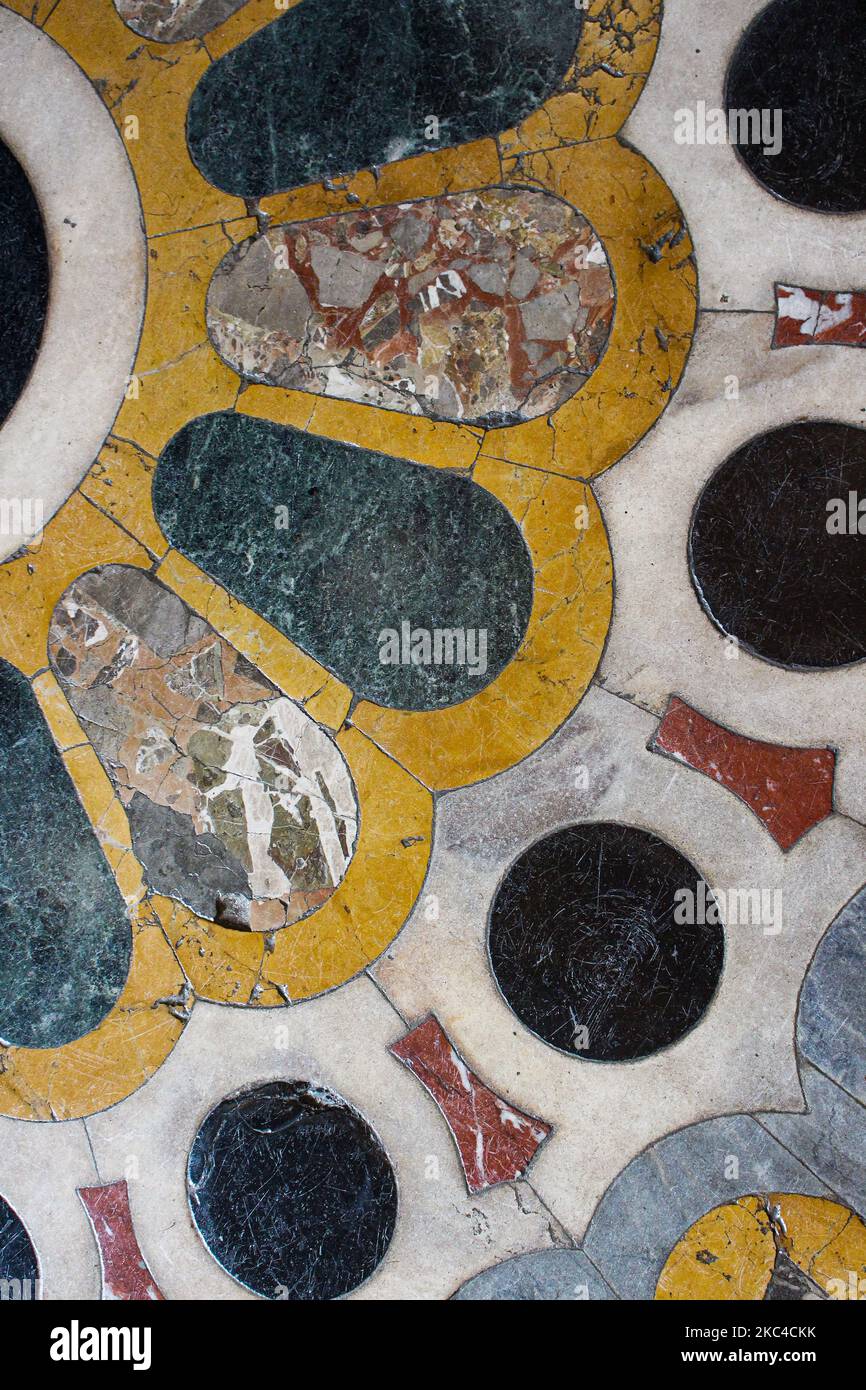 A vertical of the details of a flower-inspired marble floor mosaic ...