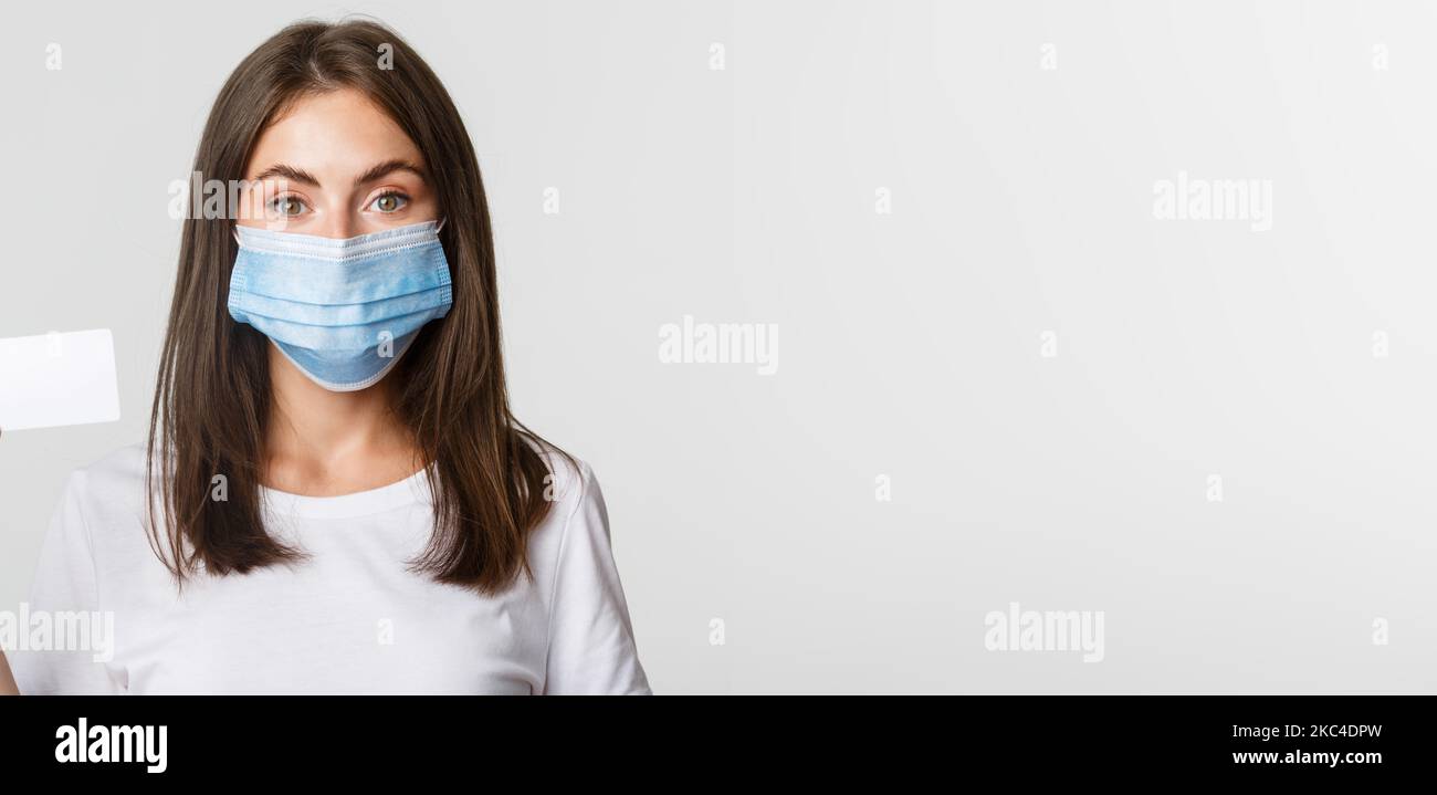 Covid-19, health and social distancing concept. Close-up of pretty ...