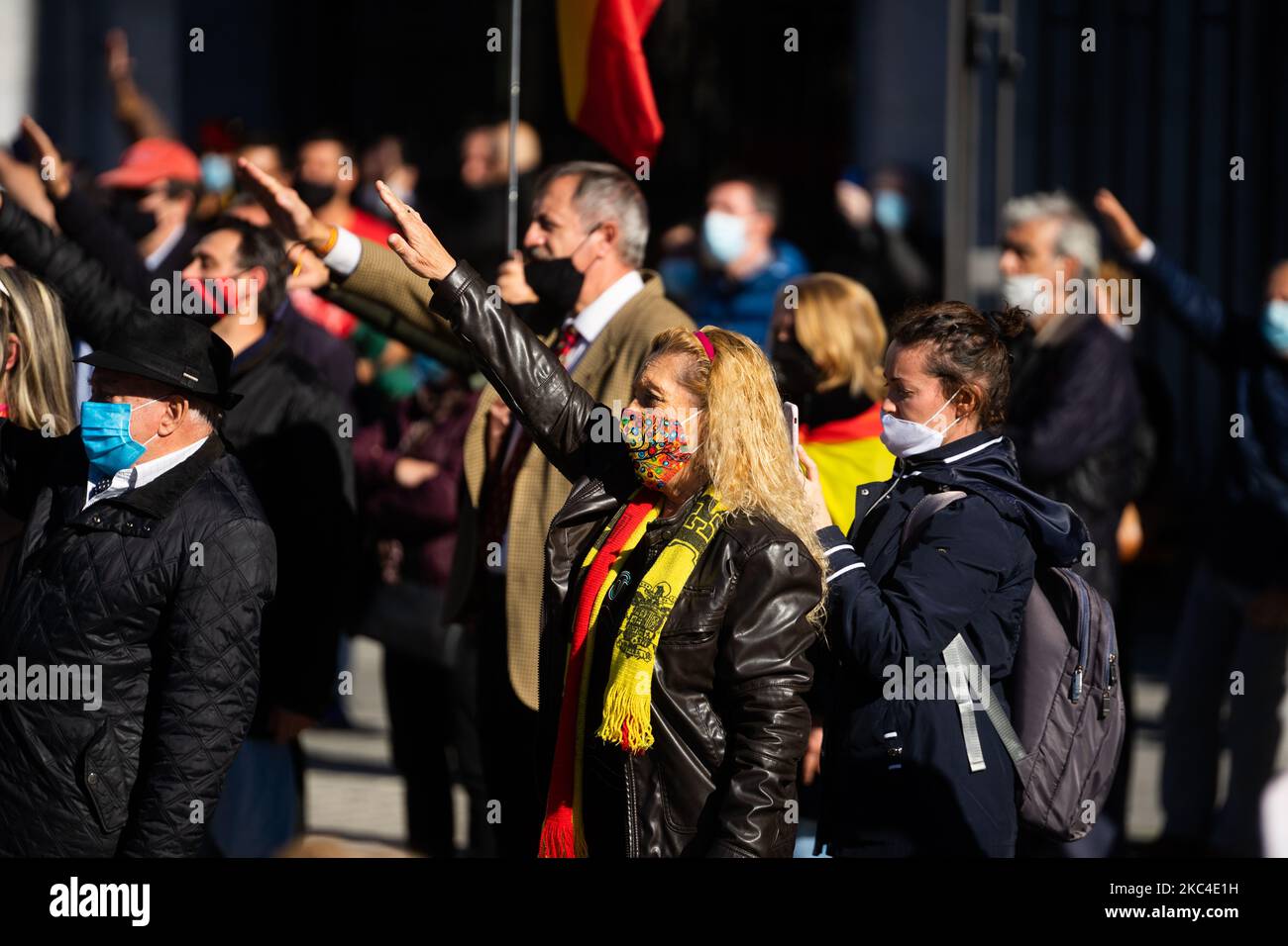 Franco supporters, raise their arms, making the fascist salute, when ...