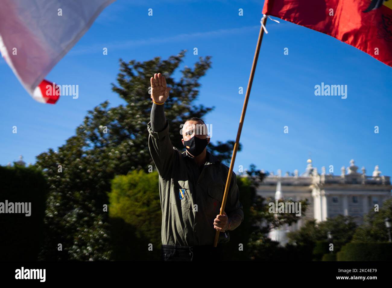 Franco supporters, raise their arms, making the fascist salute, when ...