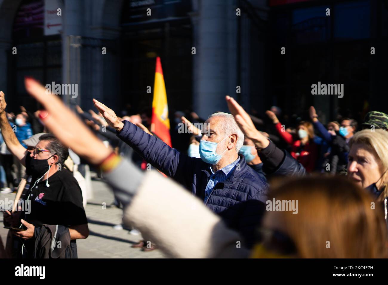 Franco supporters, raise their arms, making the fascist salute, when ...