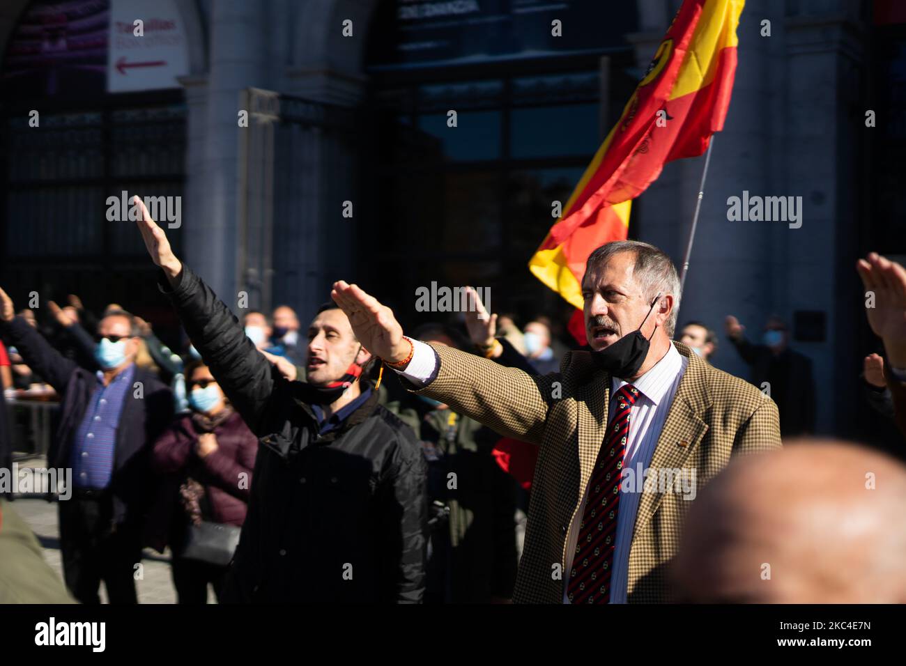 Franco supporters, raise their arms, making the fascist salute, when ...
