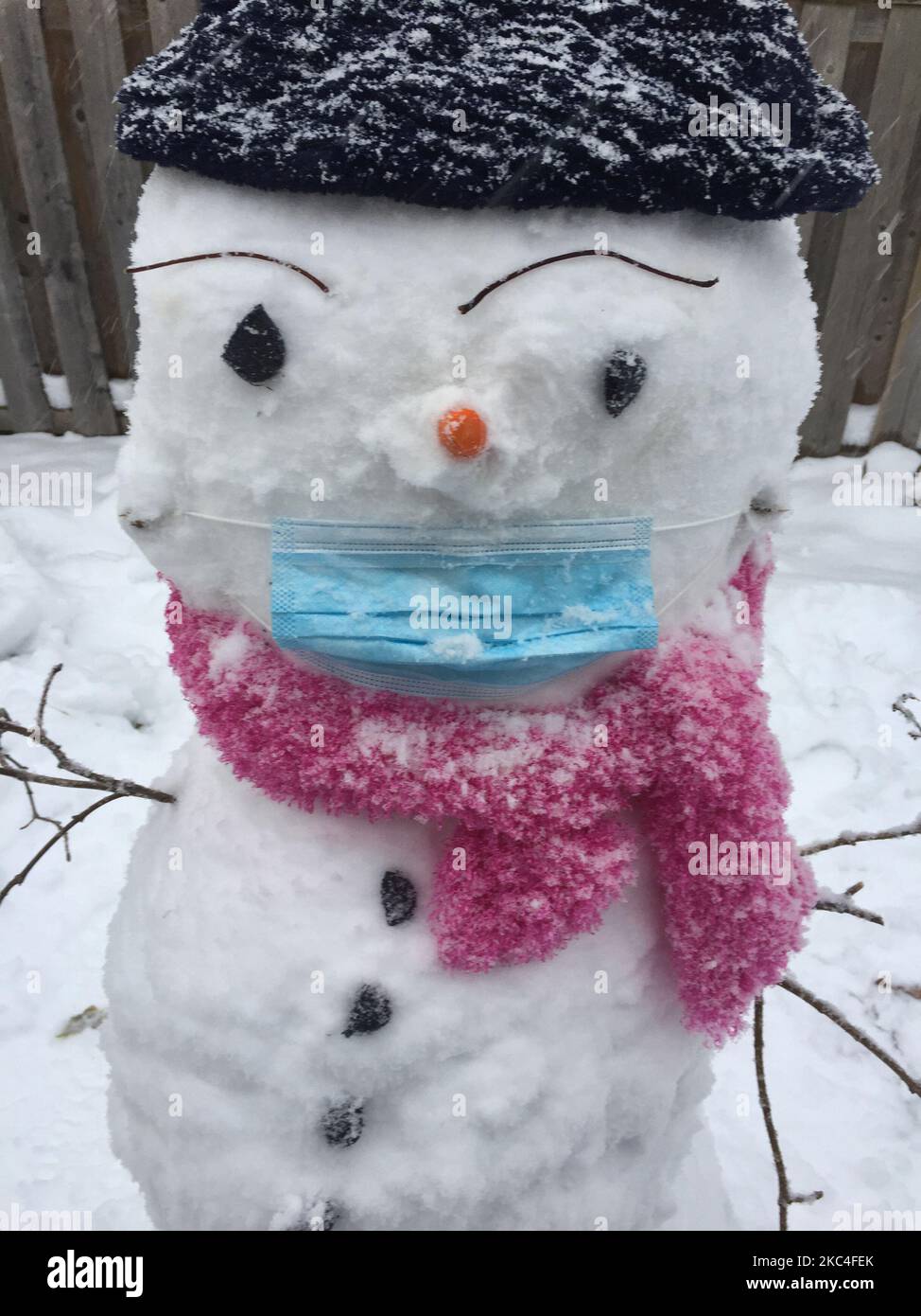 Snowman wearing a face mask during the novel coronavirus (COVID-19 ...