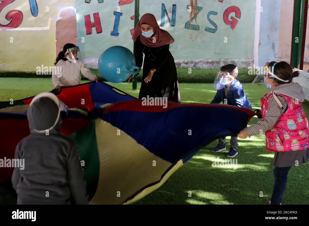 Palestinians school children, clad in masks and face-shields due to the ...