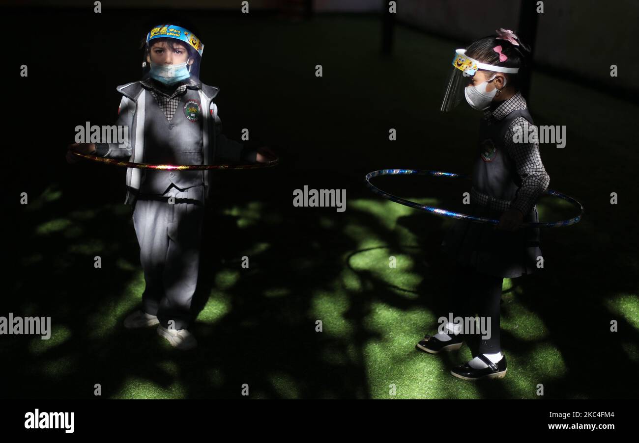 Palestinians school children, clad in masks and face-shields due to the ...