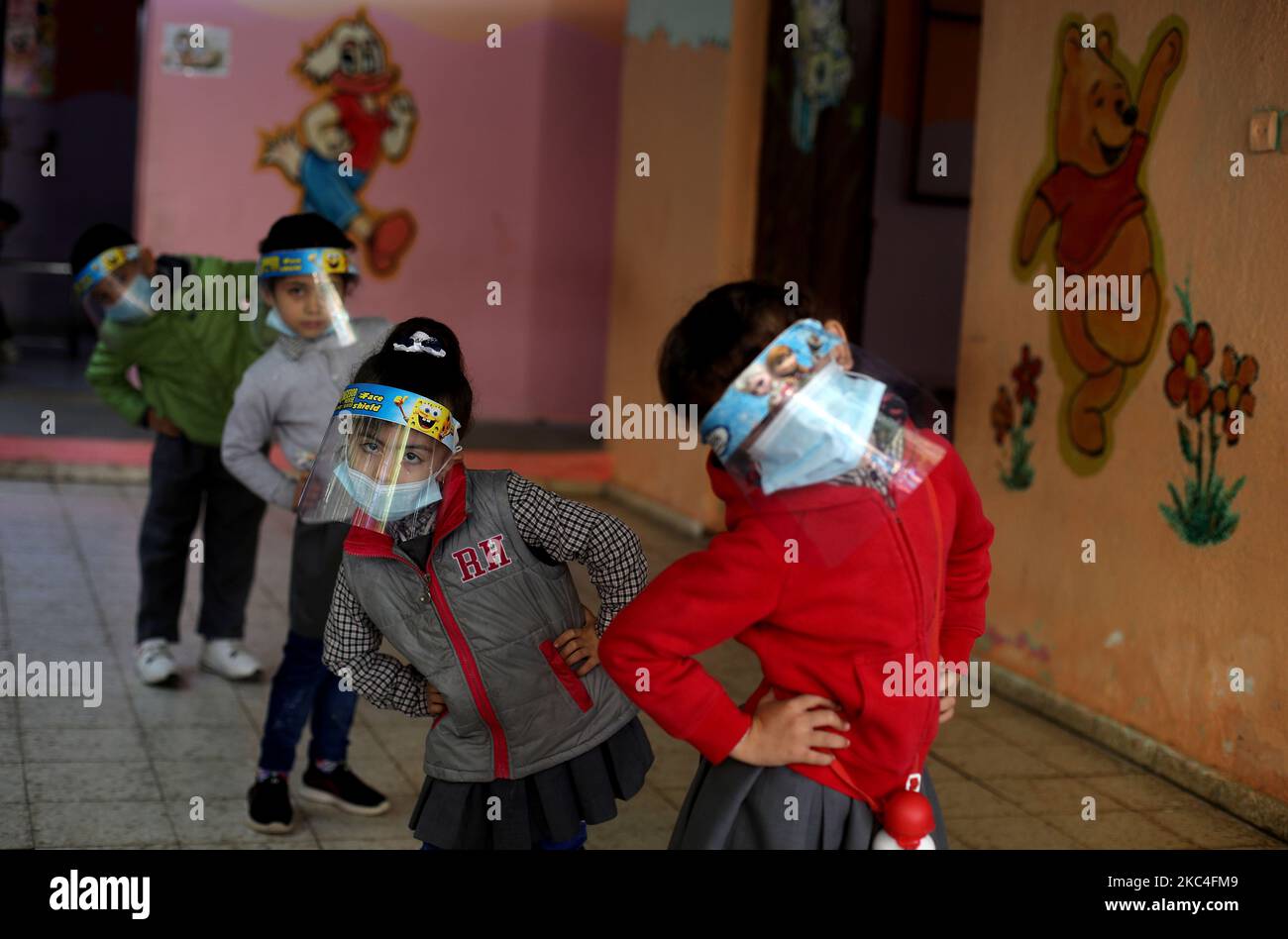 Palestinians school children, clad in masks and face-shields due to the ...