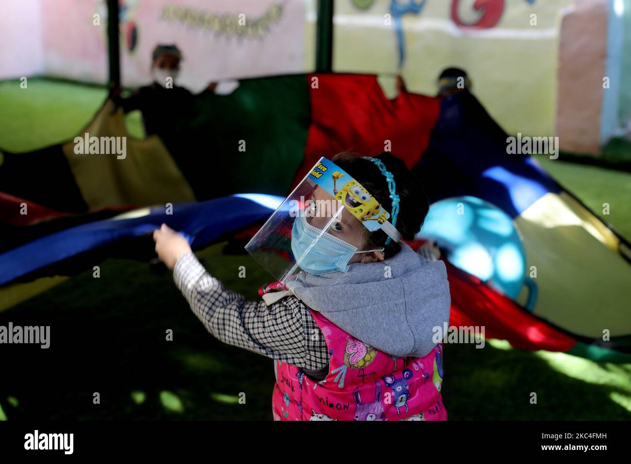 Palestinians school children, clad in masks and face-shields due to the ...