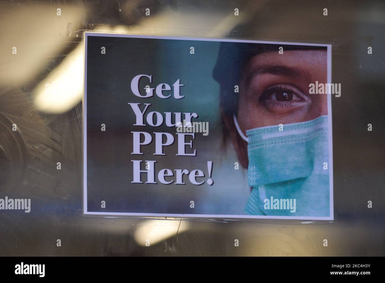 A sign 'Get Your PPE Here' seen in a shop window, in Dublin's city ...