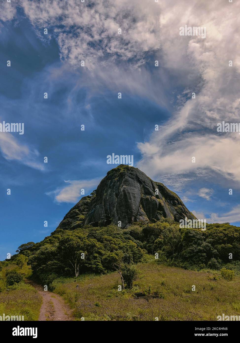 A vertical view of Mount Tibrogargan in Australia against a beautiful ...