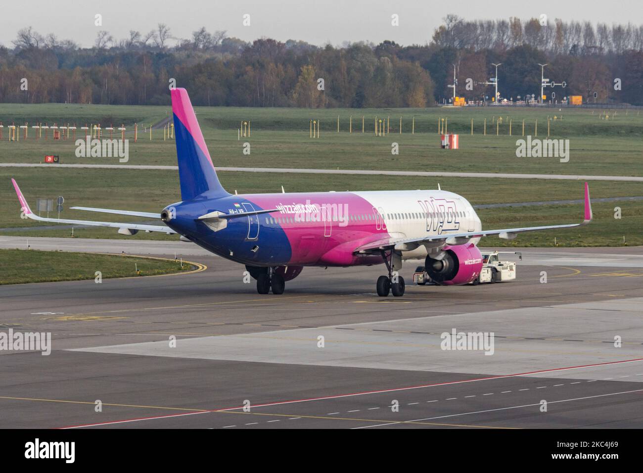 Wizz Air Airbus A321NEO aircraft as seen taxiing and taking off, departing from Eindhoven EIN ...