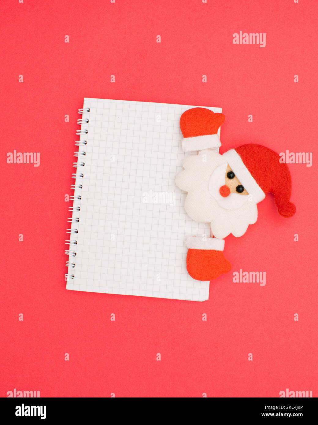 A Santa Claus with a red cap and winter gloves above the leaflet and ...