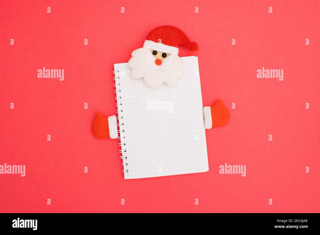A Santa Claus with a red cap and winter gloves above the leaflet and ...