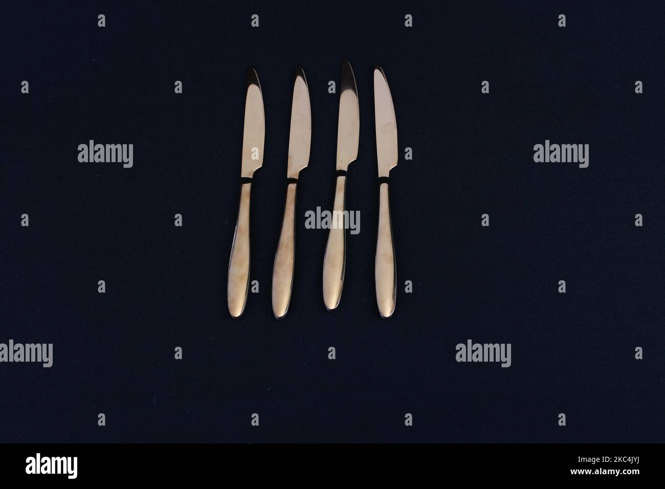 A set of steel knifes isolated on a black background Stock Photo - Alamy
