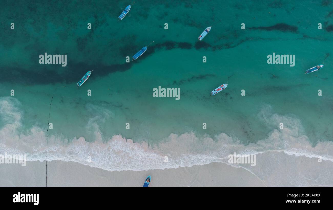 An aerial view of Tulum Beach, with boats sailing on Ocean Haiti Stock ...