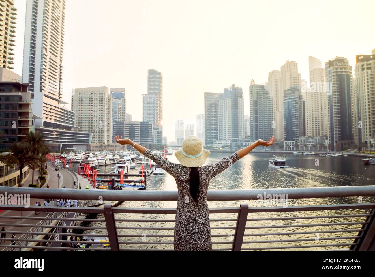 Dubai, UAE - 12th october, 2022: excited tourist girl holds up hands ...