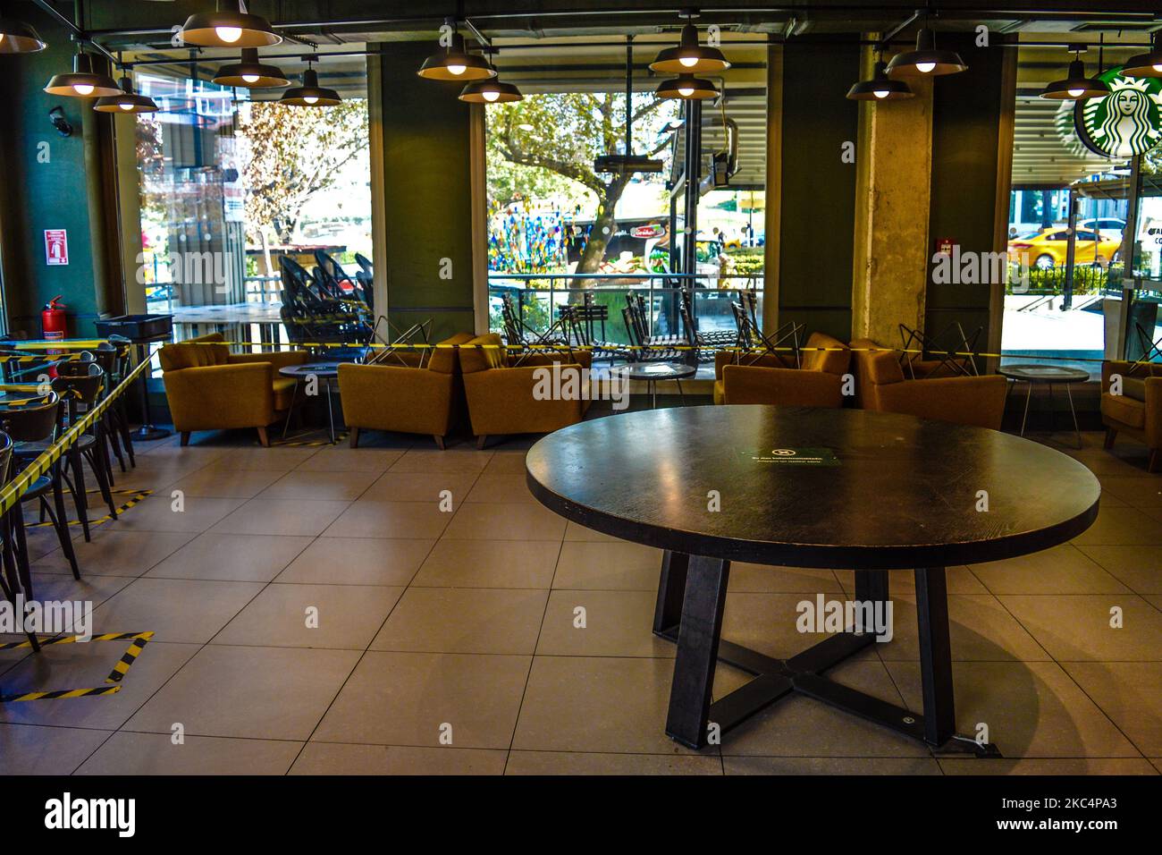 Tables are taped off at a Starbucks coffee shop amid the coronavirus ...