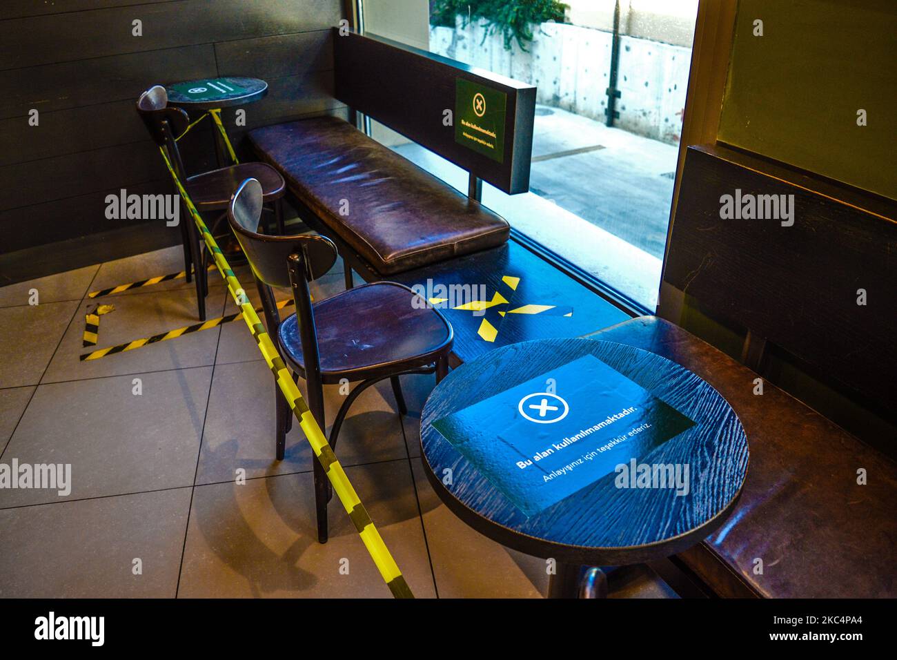 Tables are taped off at a Starbucks coffee shop amid the coronavirus ...