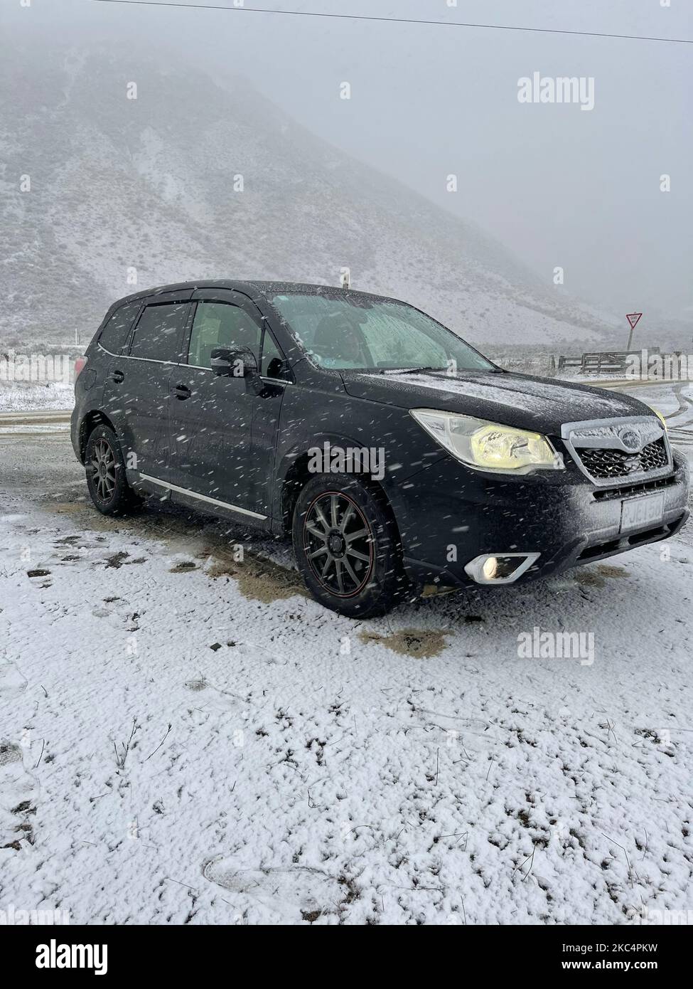 A 2013 Subaru Forester in foggy Arthur's pass covered in snow in New ...