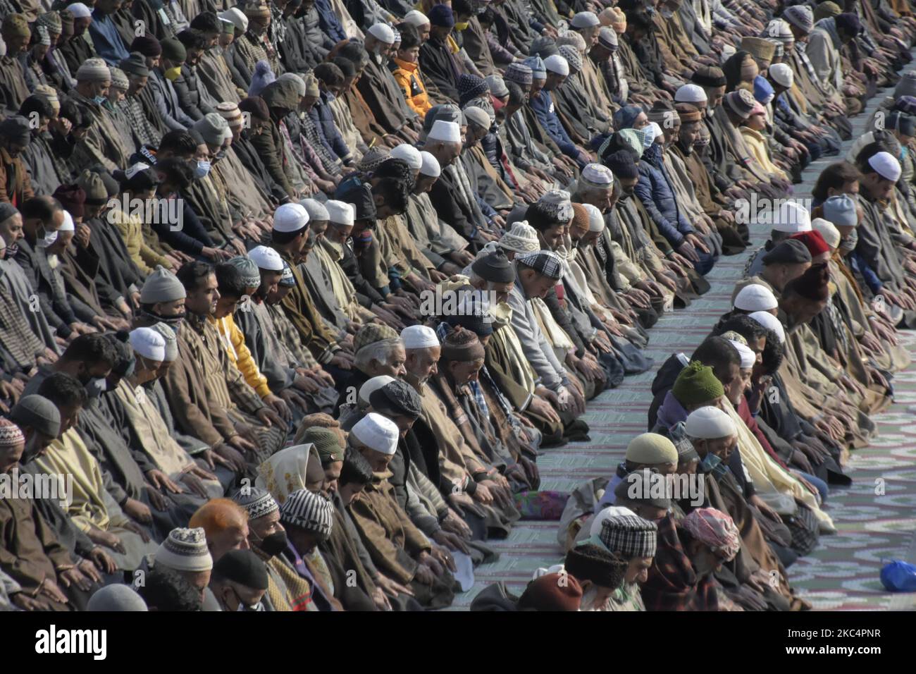 People pray outside Khanyar shirine on the eve of urs of Sheikh Abdul ...
