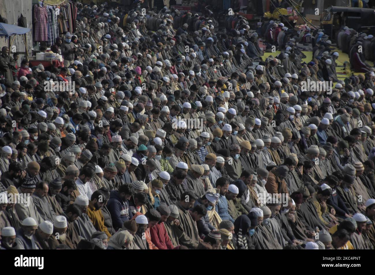 People pray outside Khanyar shirine on the eve of urs of Sheikh Abdul ...