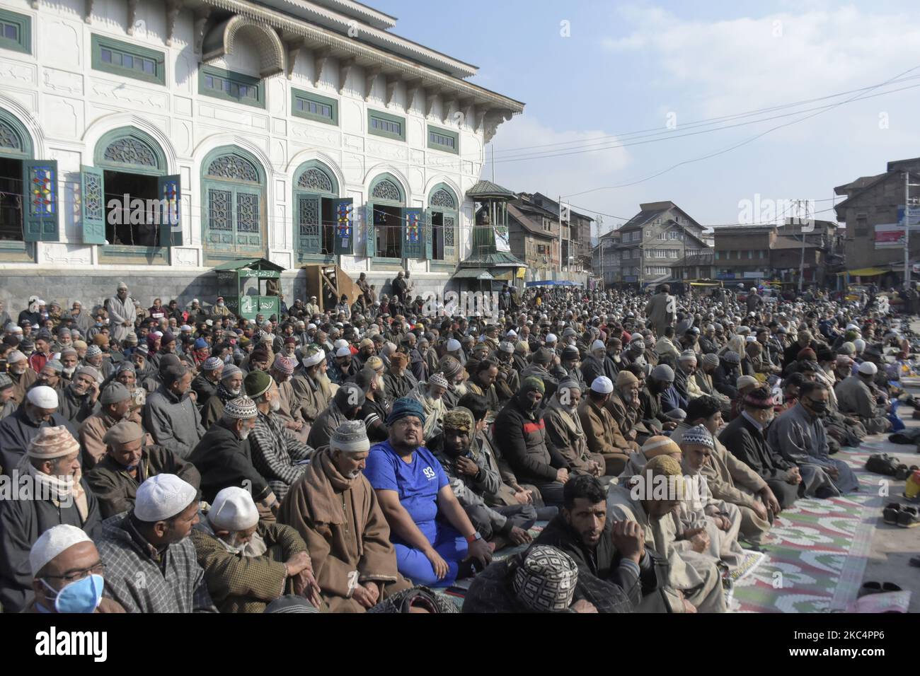 People pray outside Khanyar shirine on the eve of urs of Sheikh Abdul ...