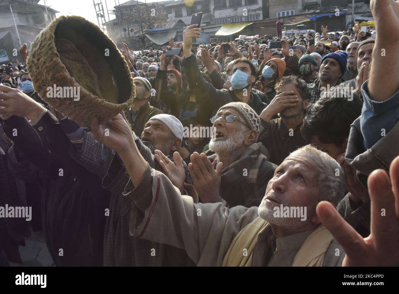 People pray outside Khanyar shirine on the eve of urs of Sheikh Abdul ...