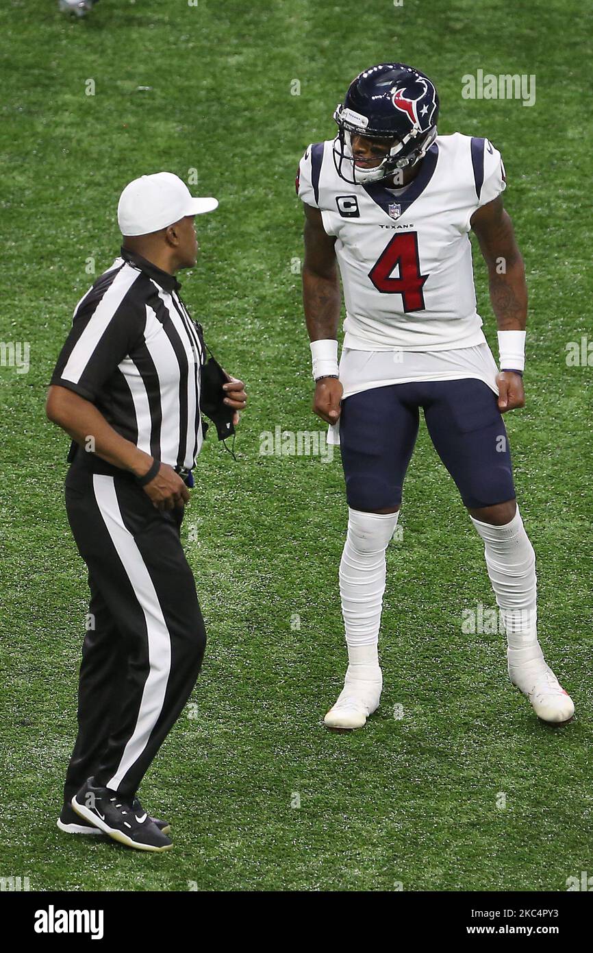 Houston Texans quarterback Deshaun Watson (4) talks to umpire Shawn ...