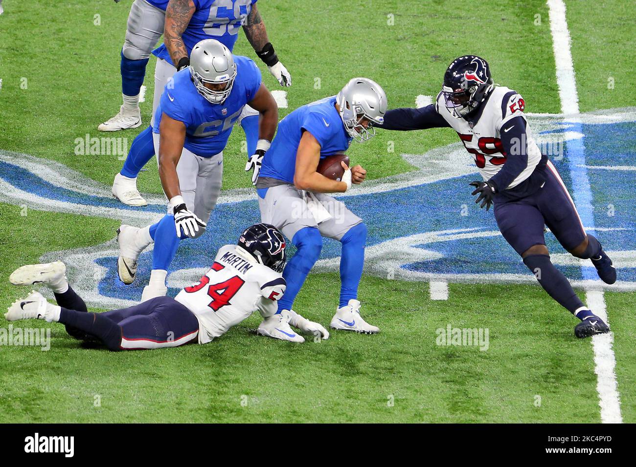 Detroit Lions quarterback Matthew Stafford (9) is sacked by Houston ...