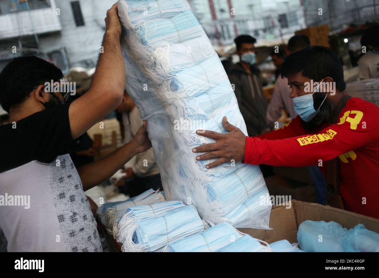 Local salesmen gather at a mask wholesale market to buy mask during ...