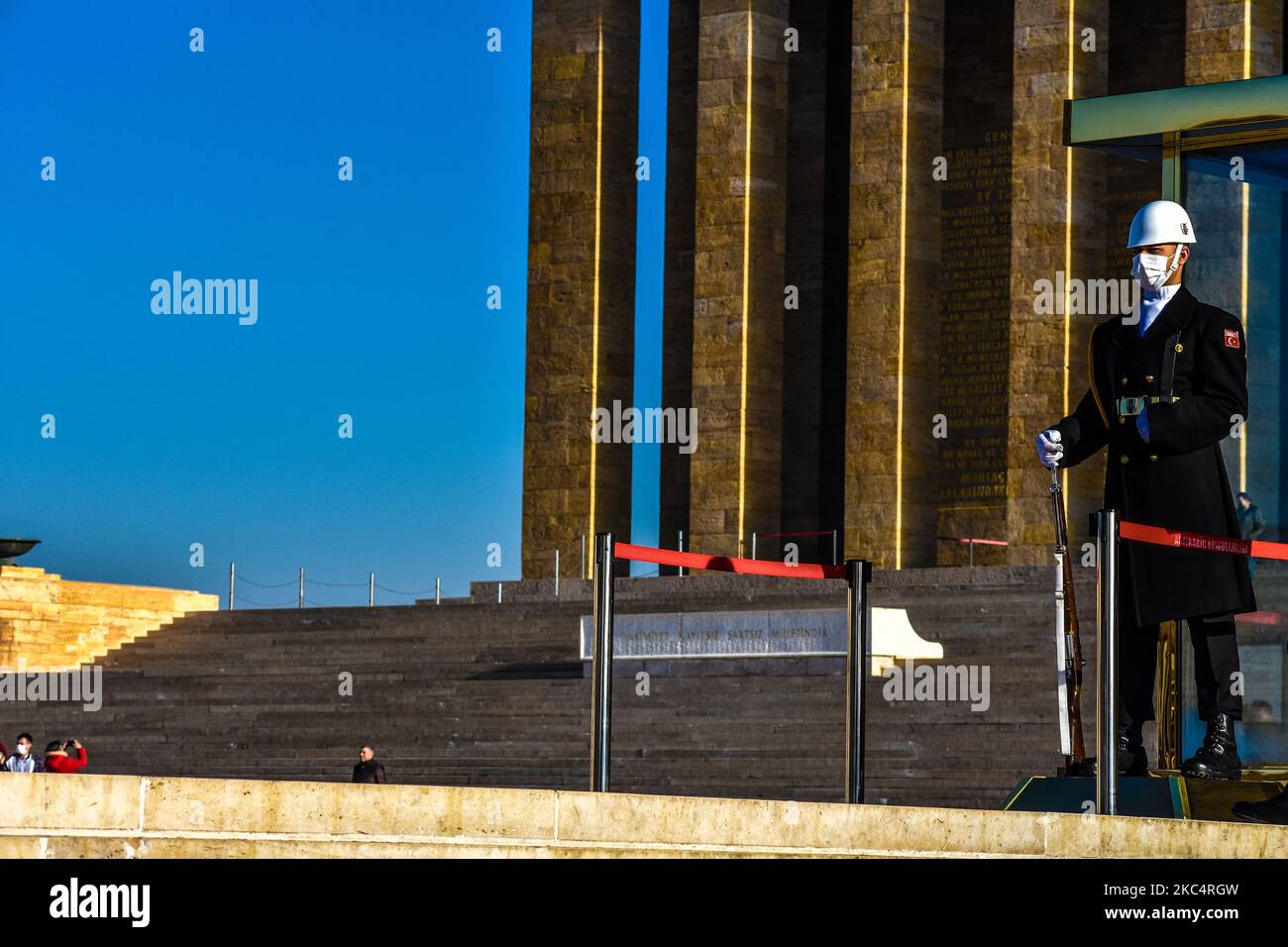 A Turkish soldier wearing a protective face mask stands during a change ...