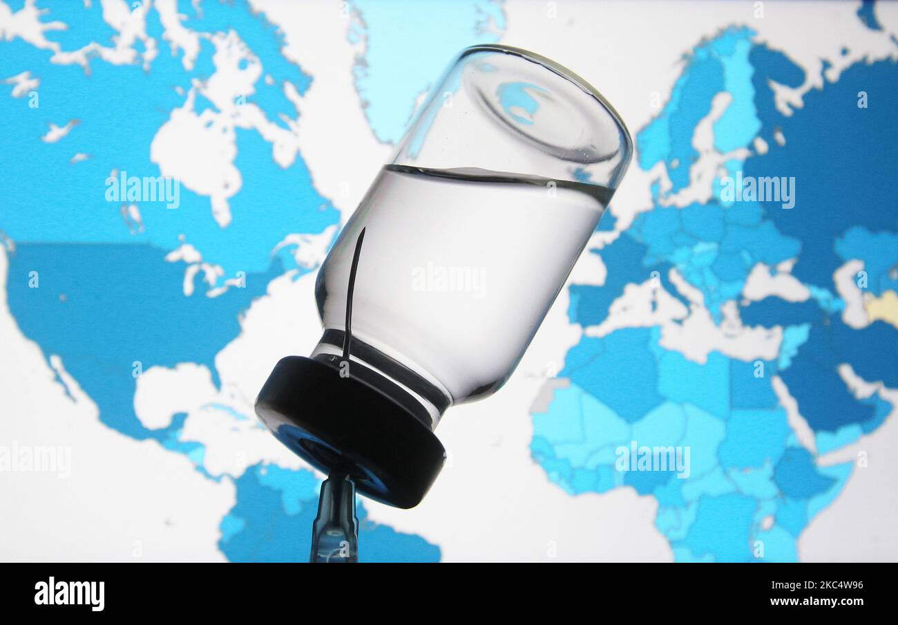 A medical syringe and a vial in front of the World Health Organization ...