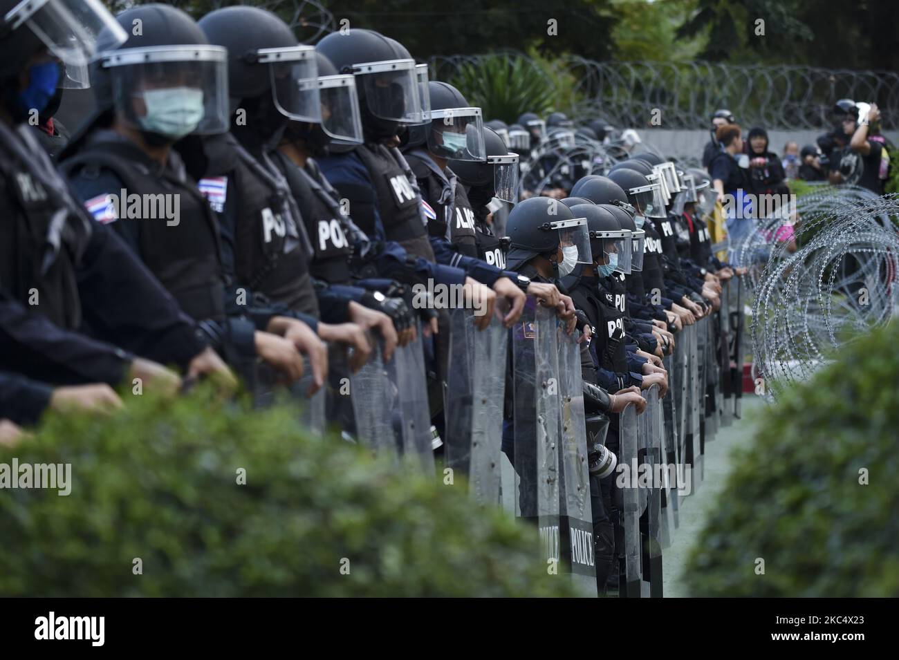Anti-riot police officers behind barbwires during an anti-government ...