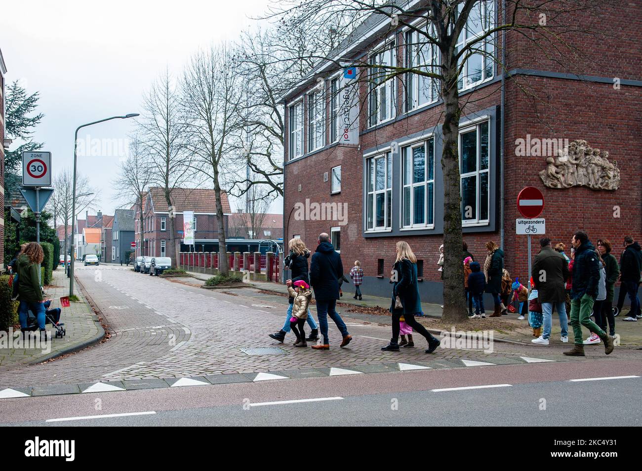 Families are waiting for the arrival of St. Nicholas on a bus to keep a ...