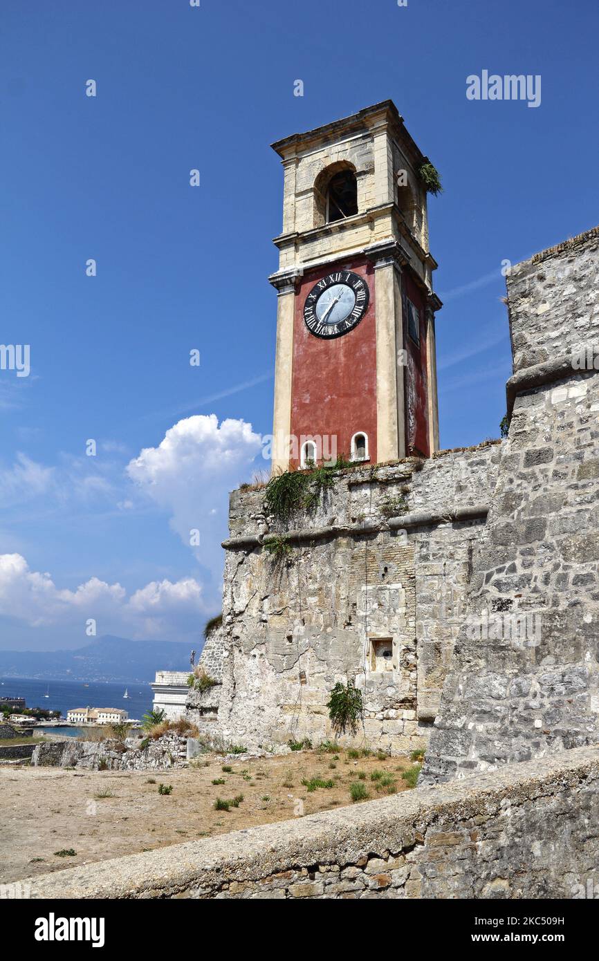 A clock tower in Greece, Corfu, Mediterranean Sea, vertical Stock Photo ...