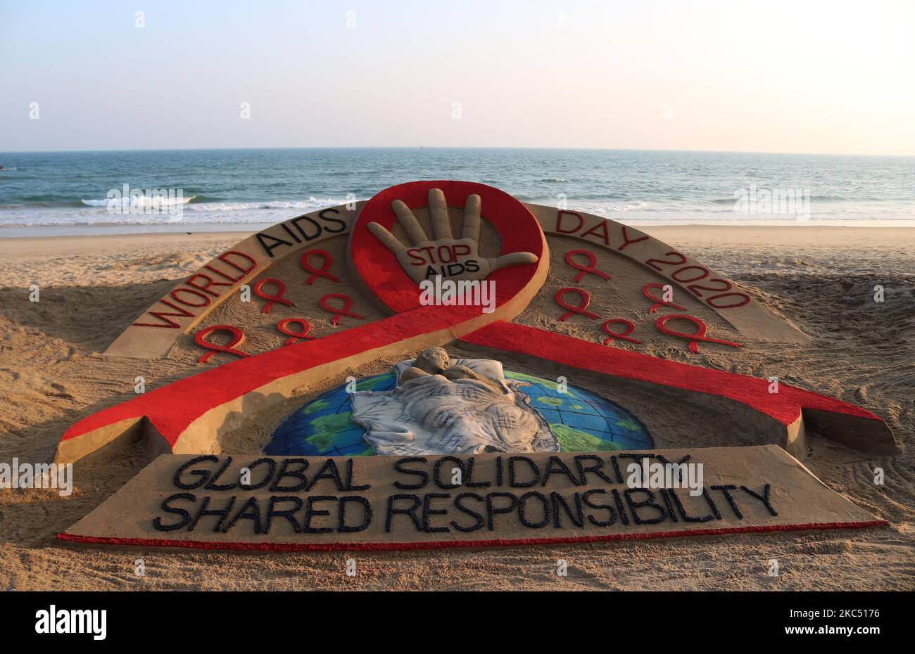 A sand sculpture is seen at the Bay of Bengal Sea's eastern coast beach ...