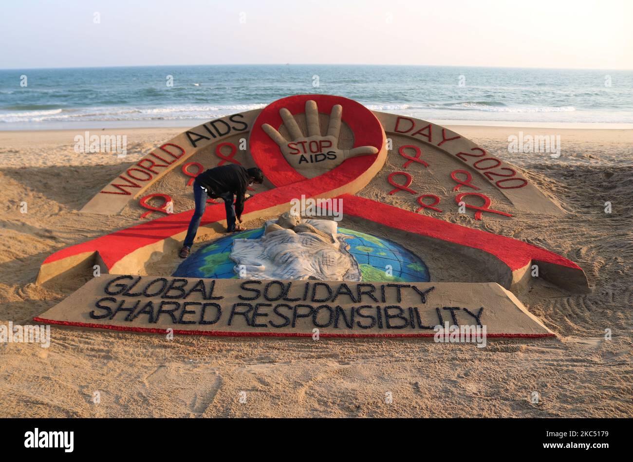 A sand sculpture is seen at the Bay of Bengal Sea's eastern coast beach ...