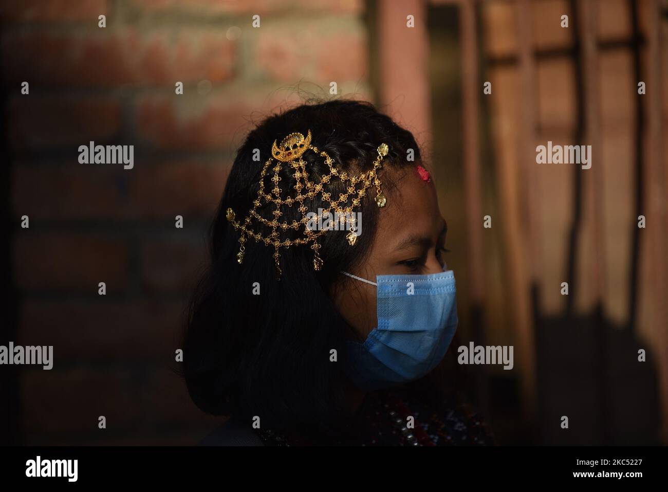 A Portrait of Nepalese girl in a traditional attire along with face ...
