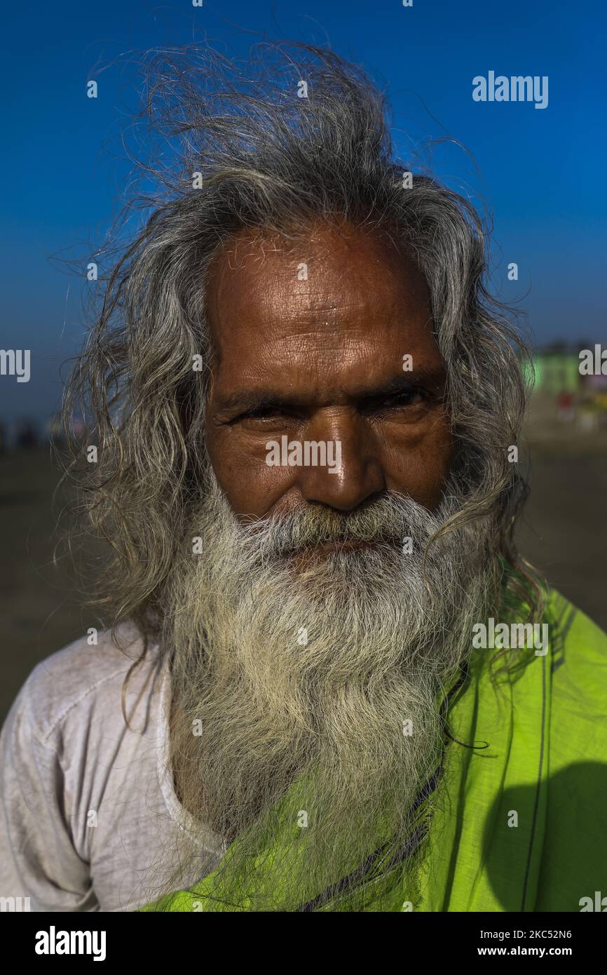 Hindu devote pose for a portrait during rashmela in the bank of Bay of ...