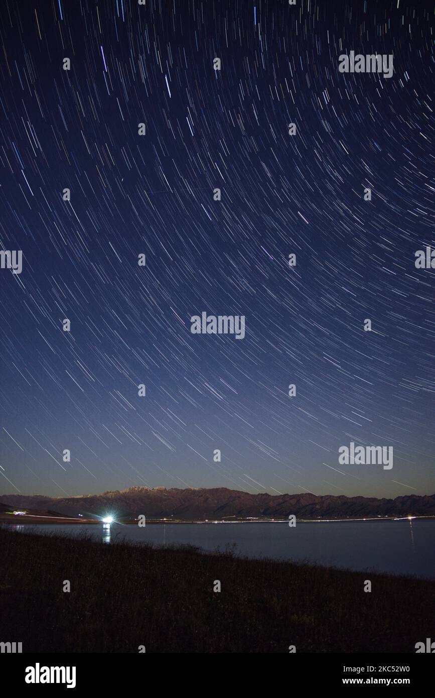 A long exposure vertical view of the starry night hiding behind the ...
