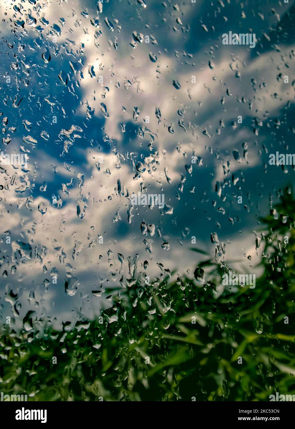 A vertical shot of a window covered in rain drops Stock Photo - Alamy