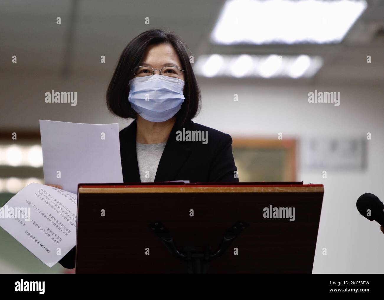 Taiwan President Tsai Ing-wen wearing a face mask attends a press ...