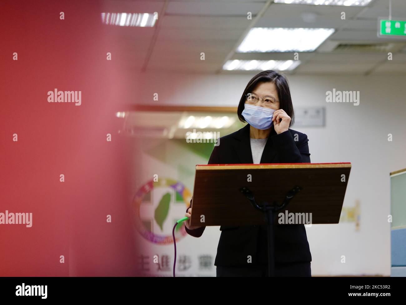 Taiwan President Tsai Ing-wen wearing a face mask attends a press ...