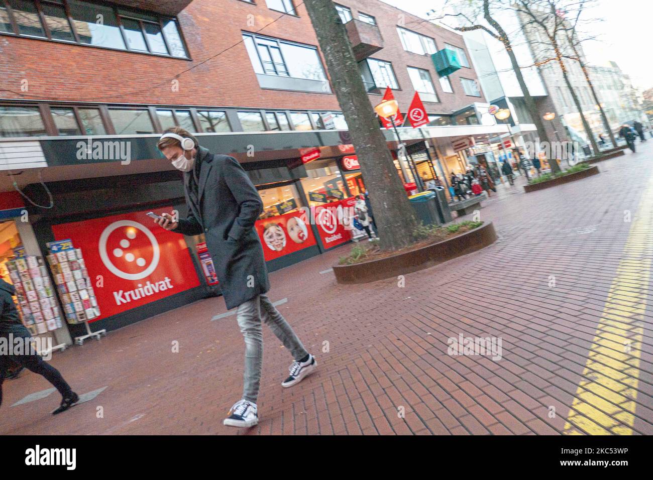 Daily life in Eindhoven city in the Netherlands with people wearing ...