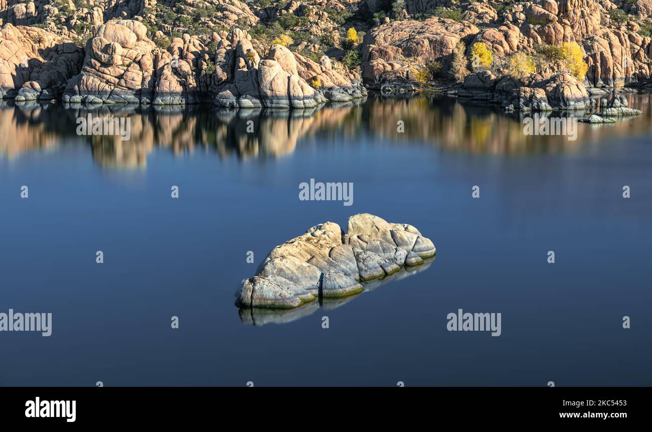 An aerial view of Solo rock Watsons surrounded by water in Arizona ...