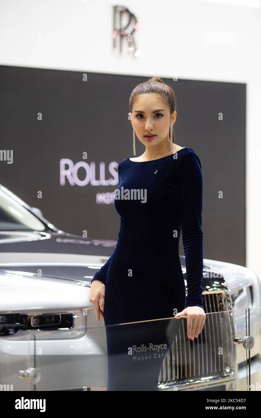 A pretty girl of Rolls Royce poses for a photo during the Thailand ...