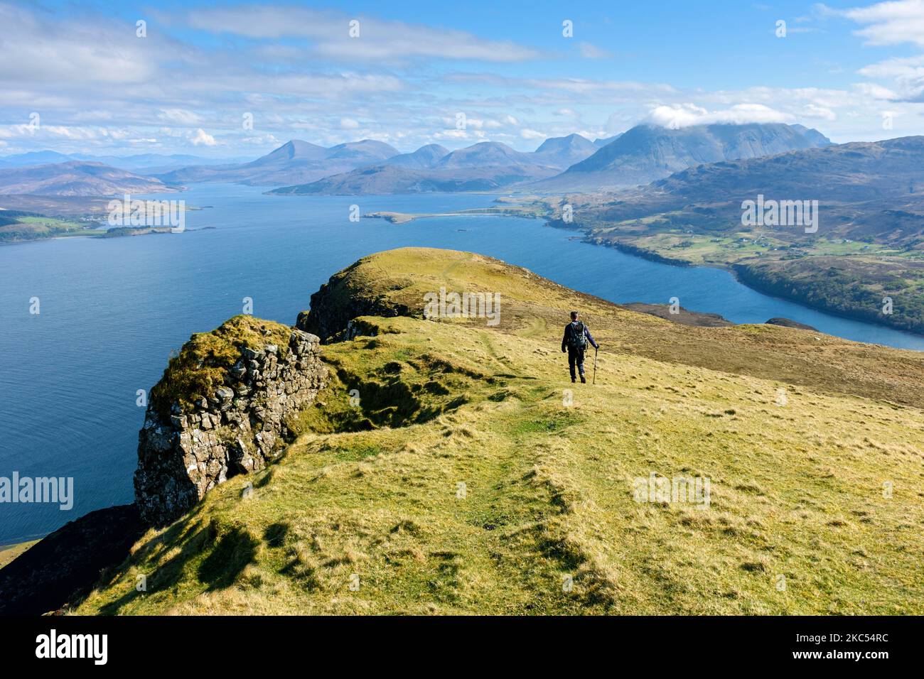 A walker on the summit ridge of Ben Tianavaig looking over the Inner ...