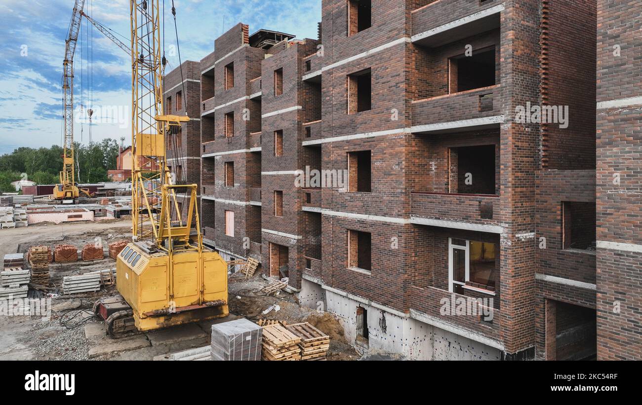 Construction site of low-rise brick houses in summer time Stock Photo ...