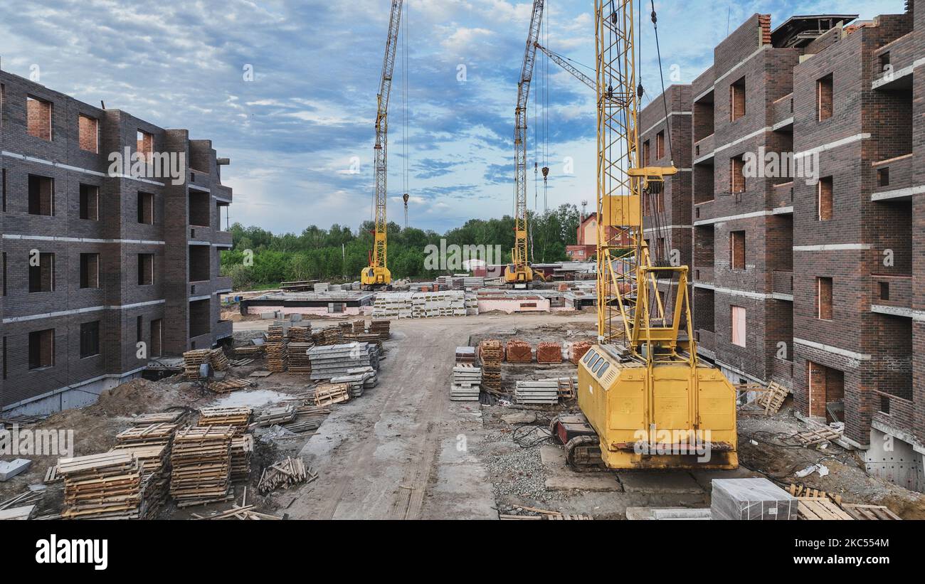 Construction site of low-rise brick houses in summer time Stock Photo ...