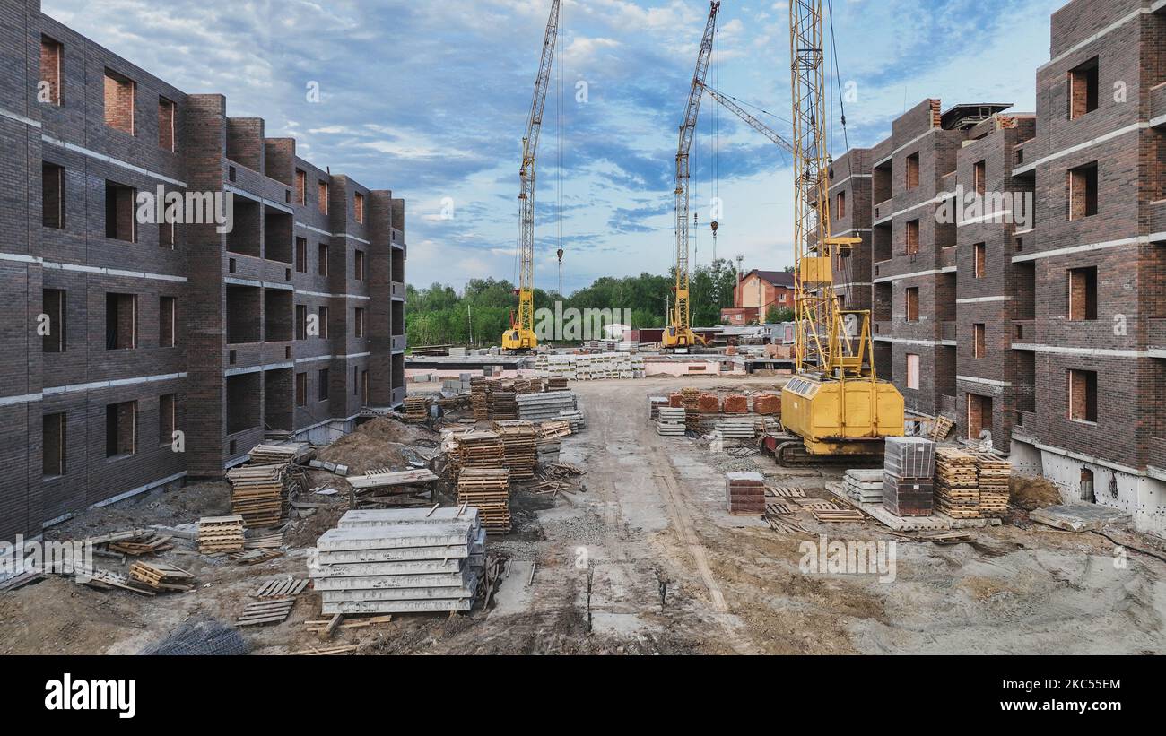 Construction site of low-rise brick houses in summer time Stock Photo ...